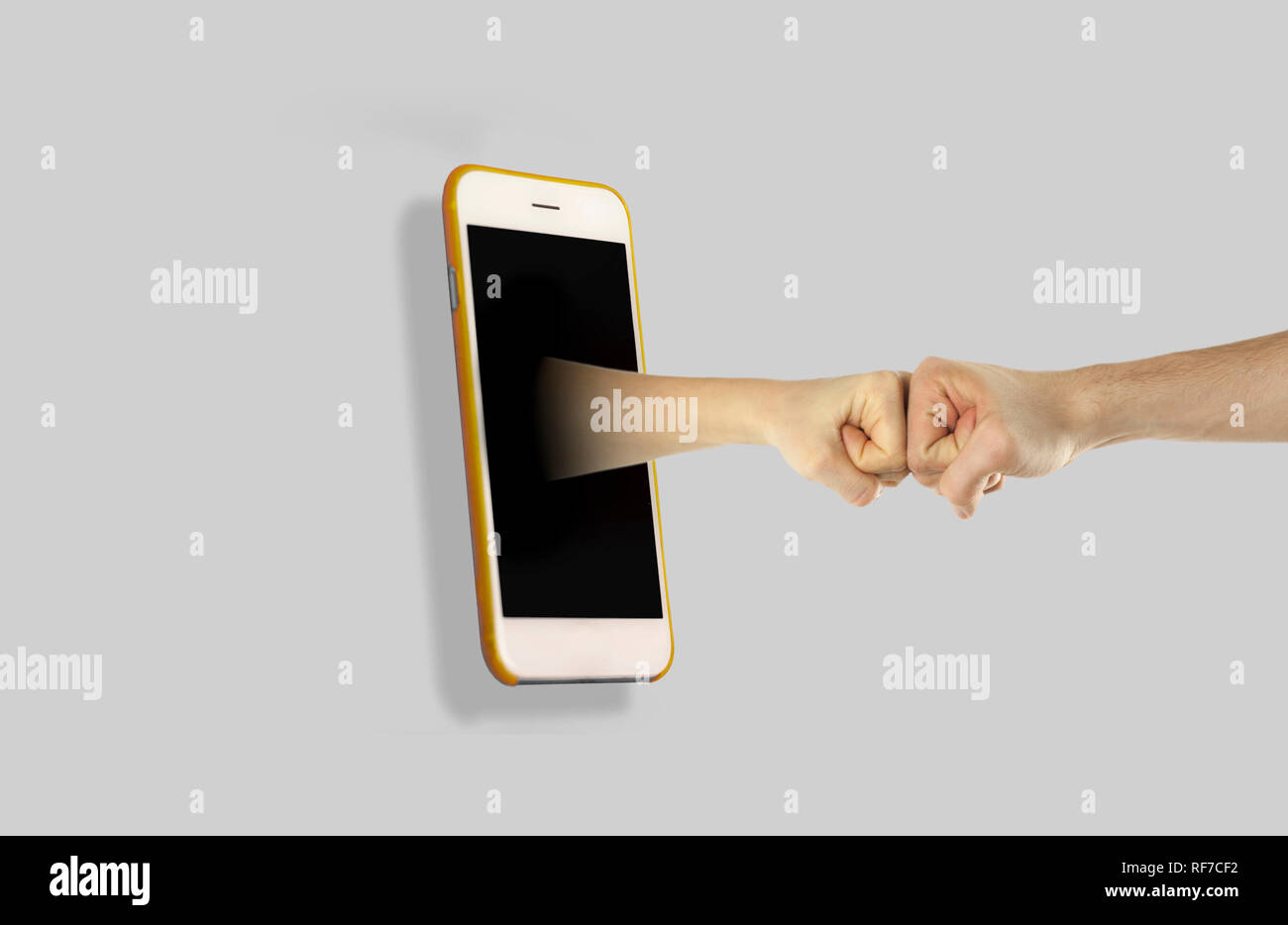 A hand holding a hand sticking out of the phone screen on an isolated ...