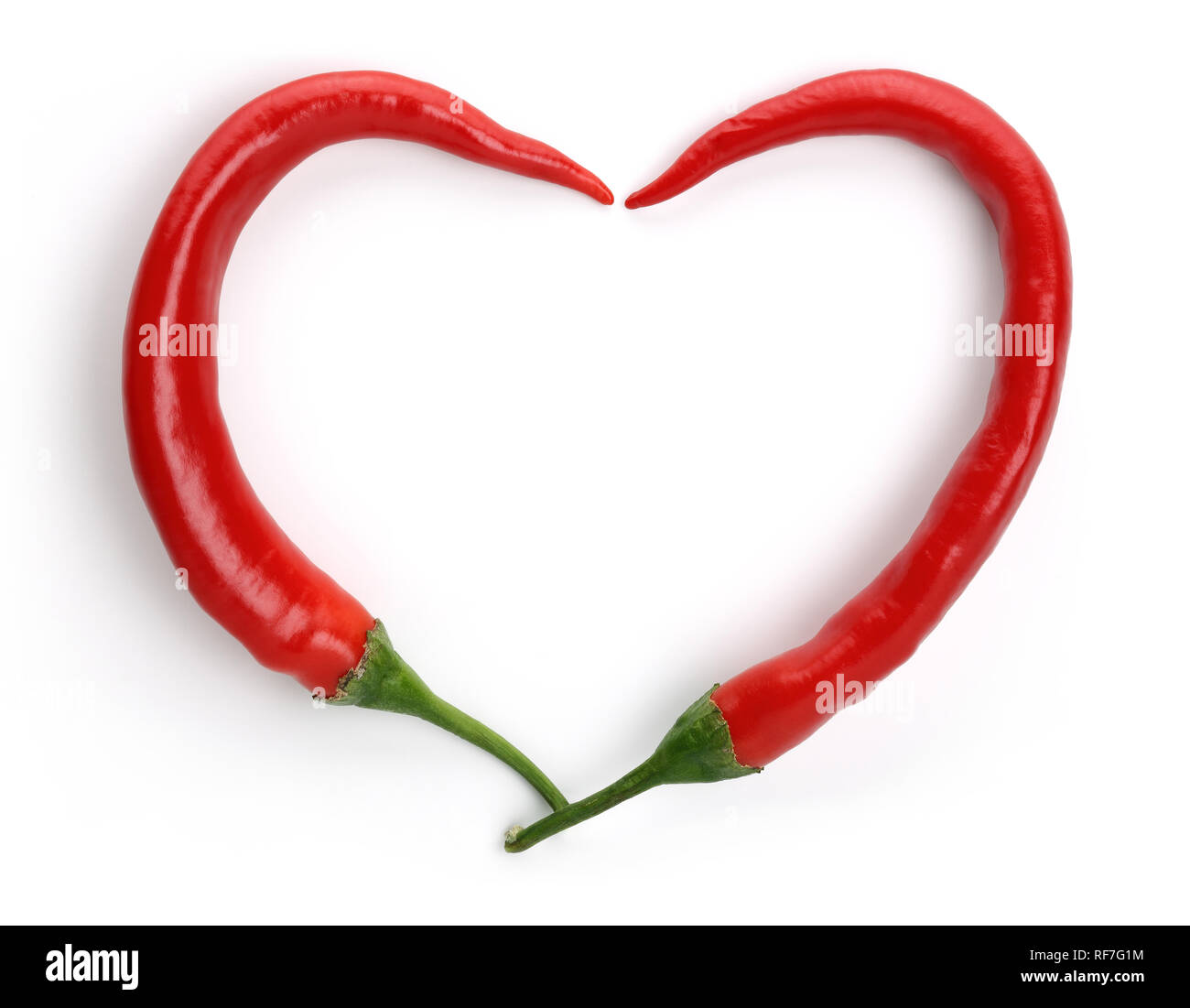 Heart shape made of red peppers, isolated on white background Stock ...