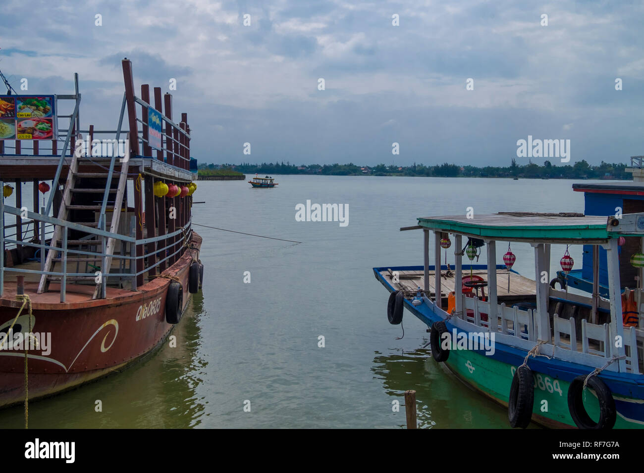 Day boats on the Thu Bon River in Hoi An, Vietnam Stock Photo - Alamy