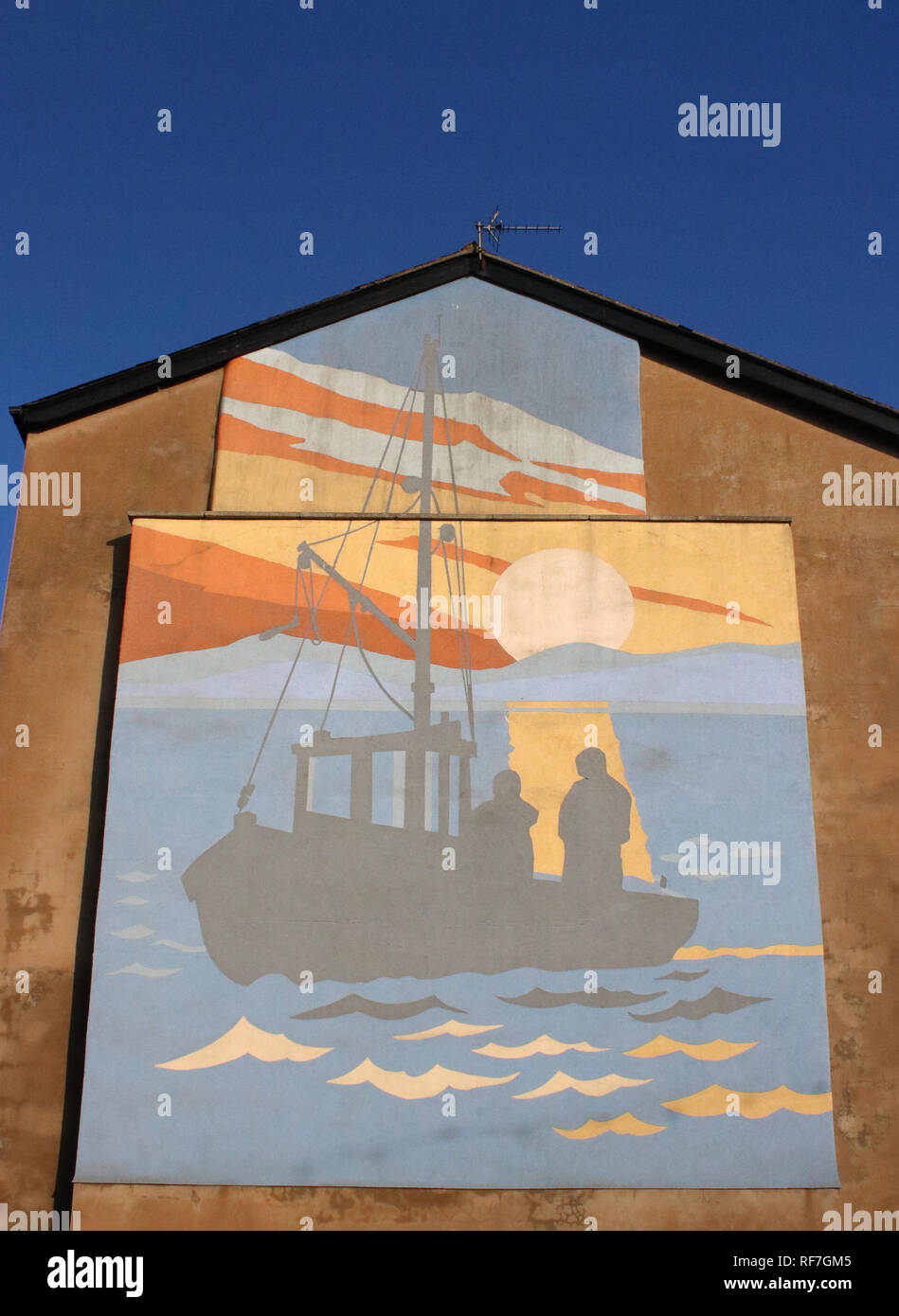 Fishing boat mural below gable end of a building in Morecambe town ...