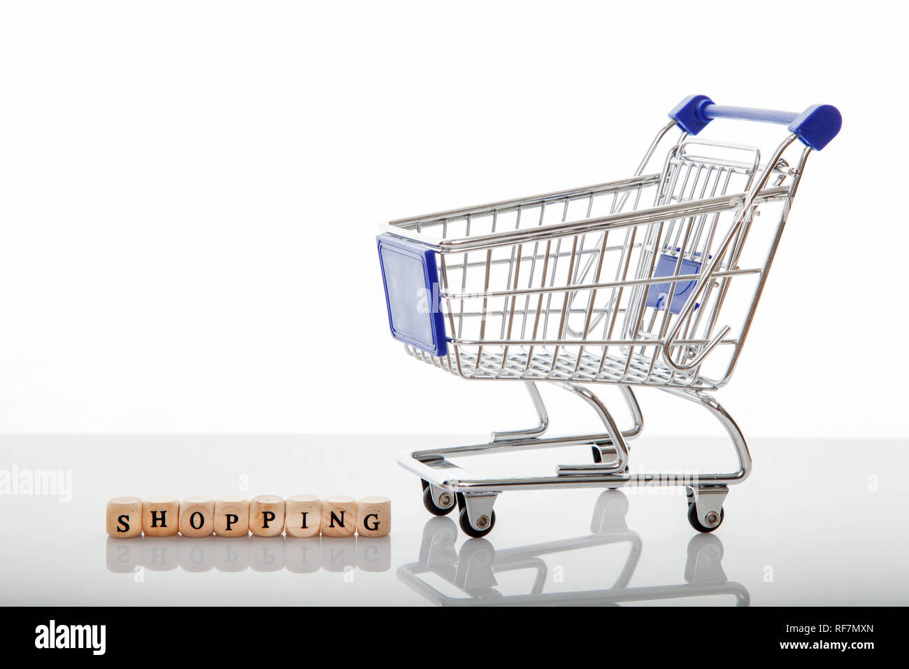 Mini shopping cart with text, Isolated photo Stock Photo - Alamy
