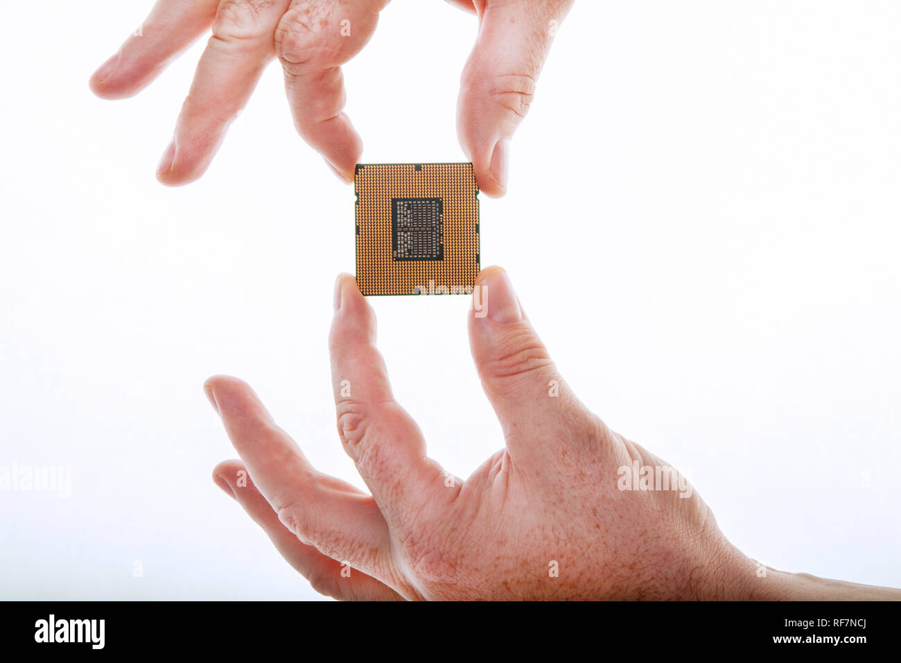 Two hands with the CPU, isolated photo Stock Photo - Alamy
