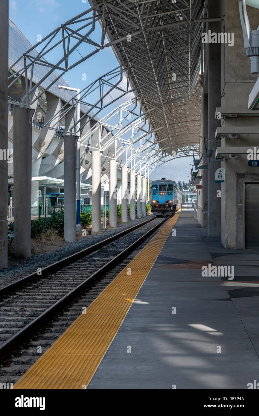 The new Tri-Rail station and trains at Miami Airport. The railway route ...