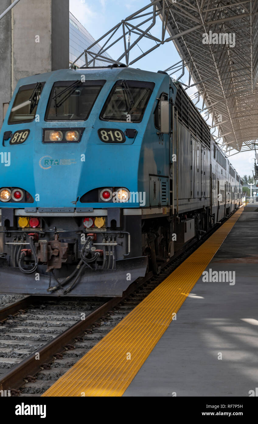 The new Tri-Rail station and trains at Miami Airport. The railway route ...