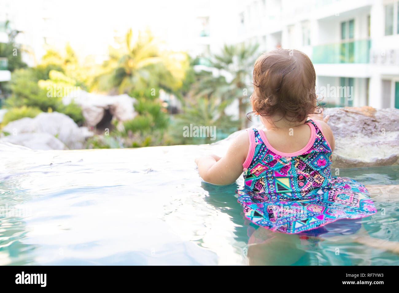 Woman in infinity pool at sunrise hi-res stock photography and images ...