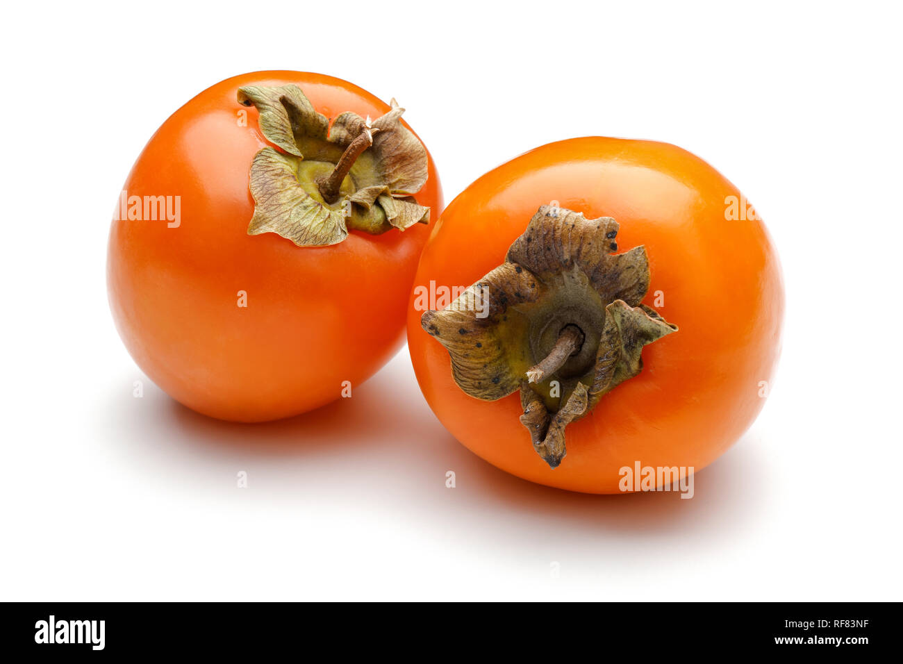 Whole cut persimmon fruits hi-res stock photography and images - Alamy