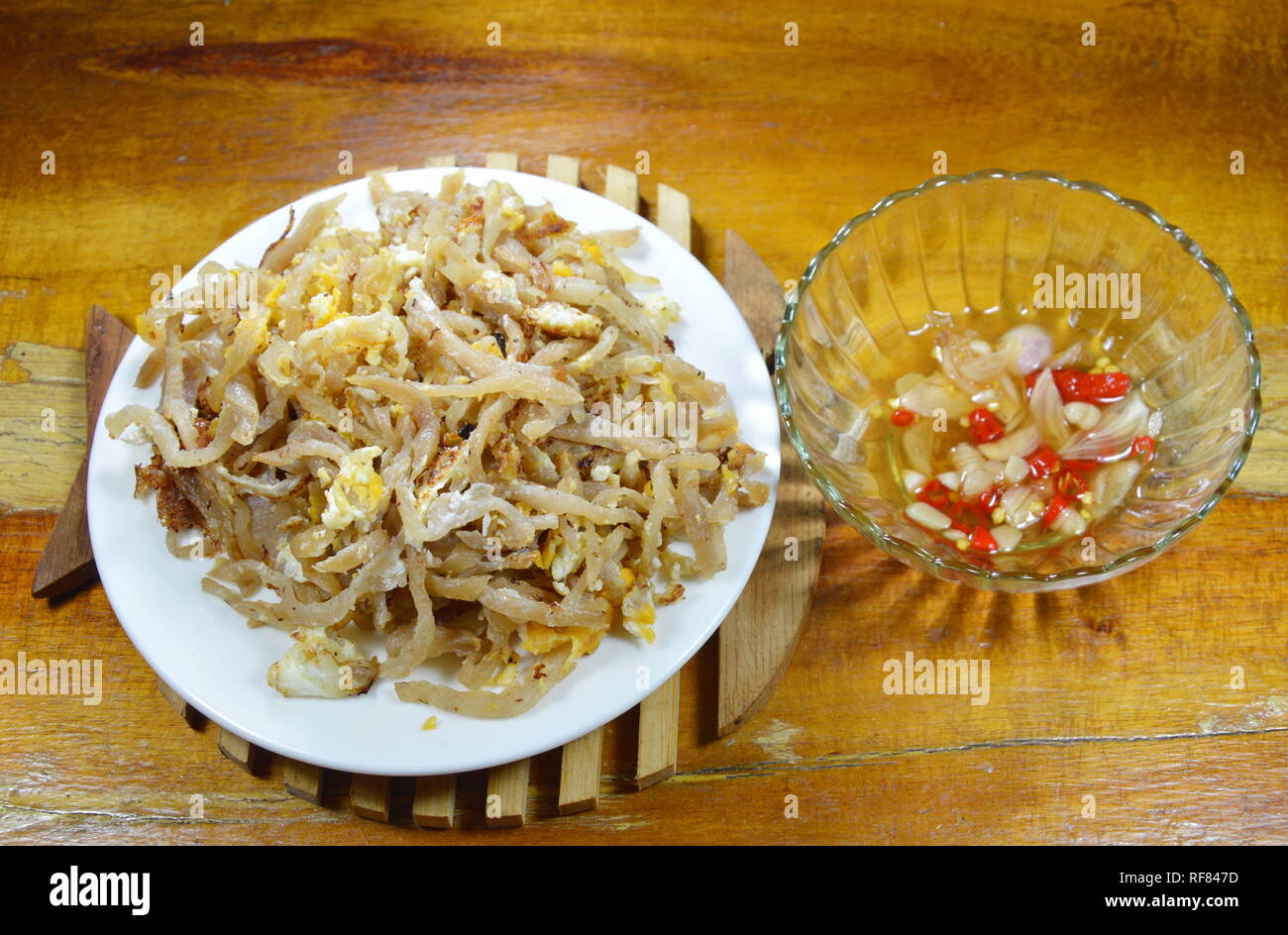 stir fried slice sweet pickled turnip with egg and fish sauce cup Stock ...