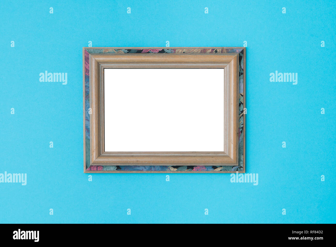 Blank empty vintage wooden frames on blue background. Art gallery ...