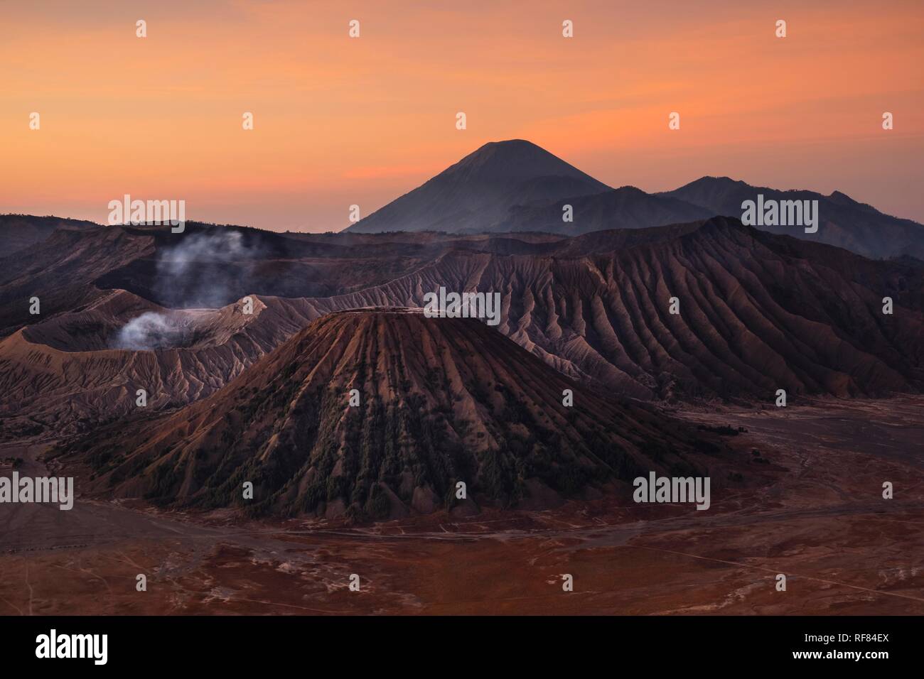 Volcanic pipes with smoking volcano Gunung Bromo, Mt. Batok, Mt. Kursi ...