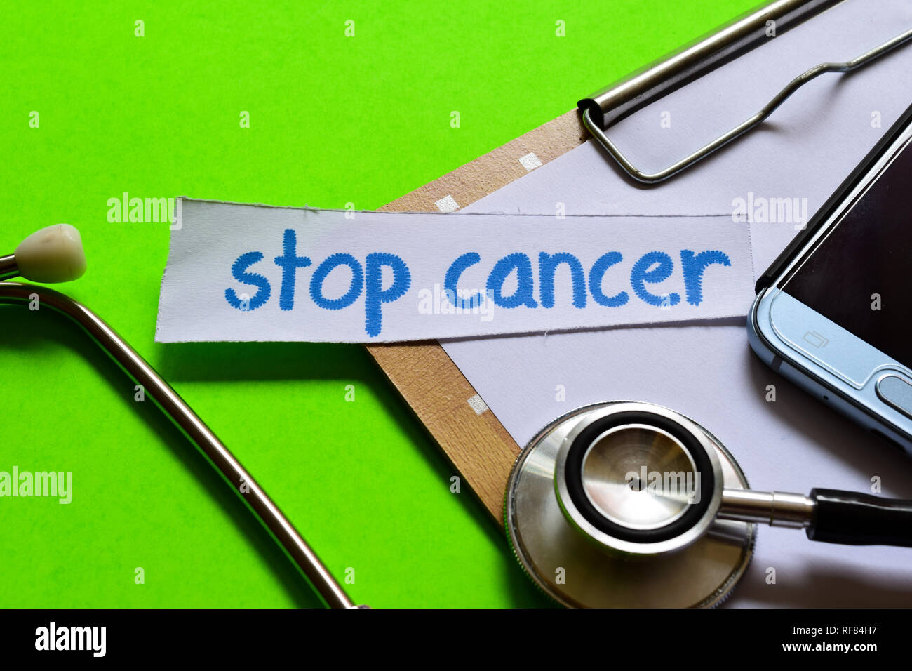 Stop cancer on healthcare concept inspiration with green background ...
