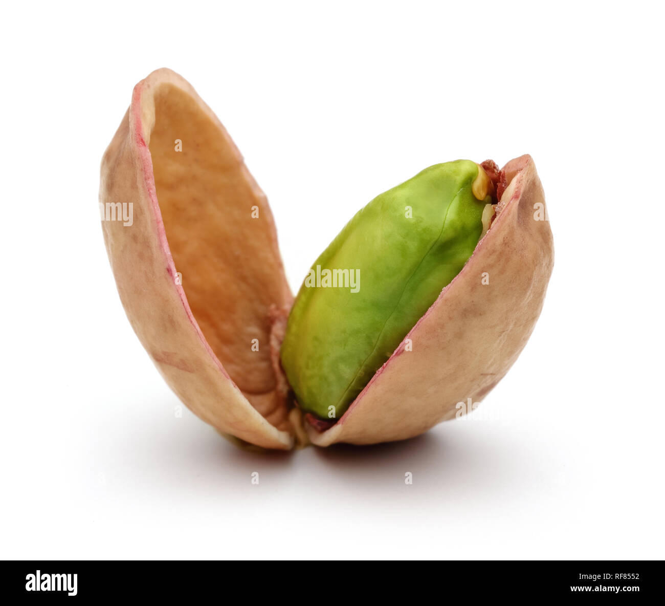Pistachio nut with open nutshell Cut Out Stock Images & Pictures - Alamy