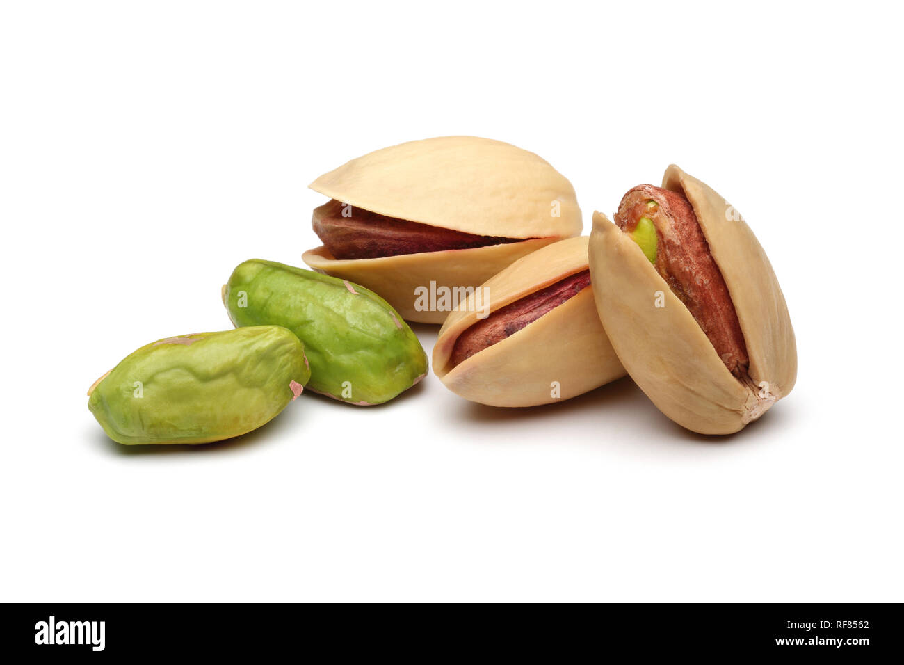 Peeled and whole pistachio nuts isolated on white background Stock ...