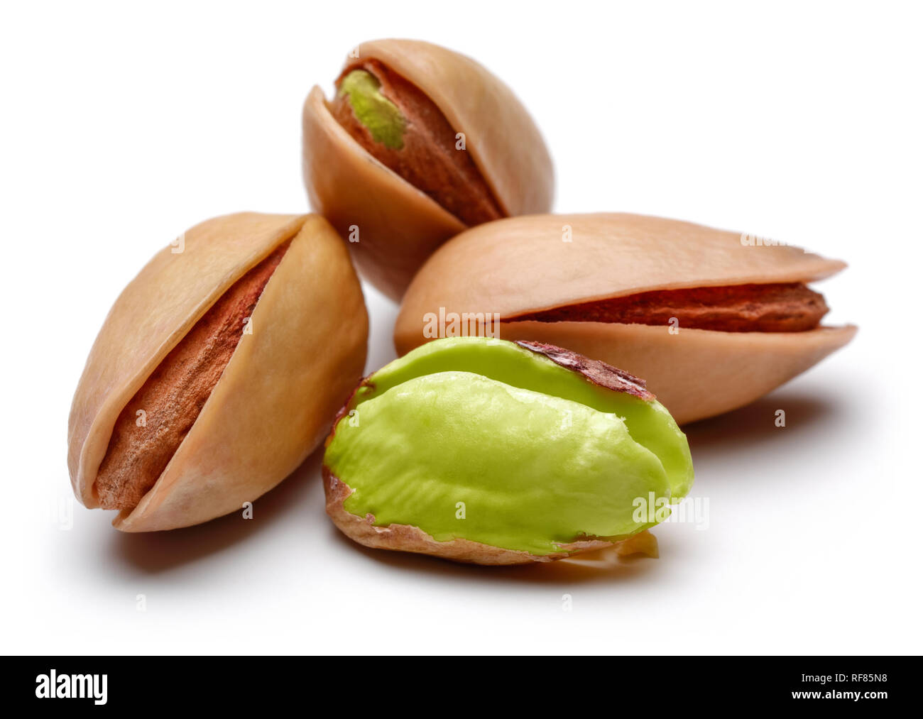 Peeled and whole pistachio nuts isolated on white background Stock ...