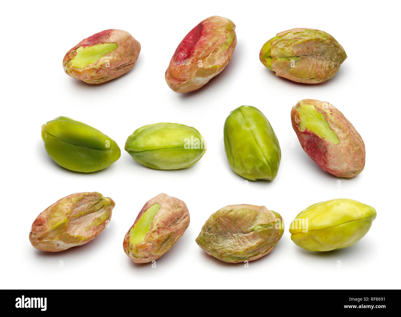 Peeled pistachio nuts isolated on white background Stock Photo - Alamy