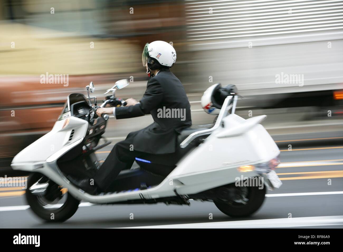 Street scene Motorbiker Tokyo Japan Stock Photo - Alamy