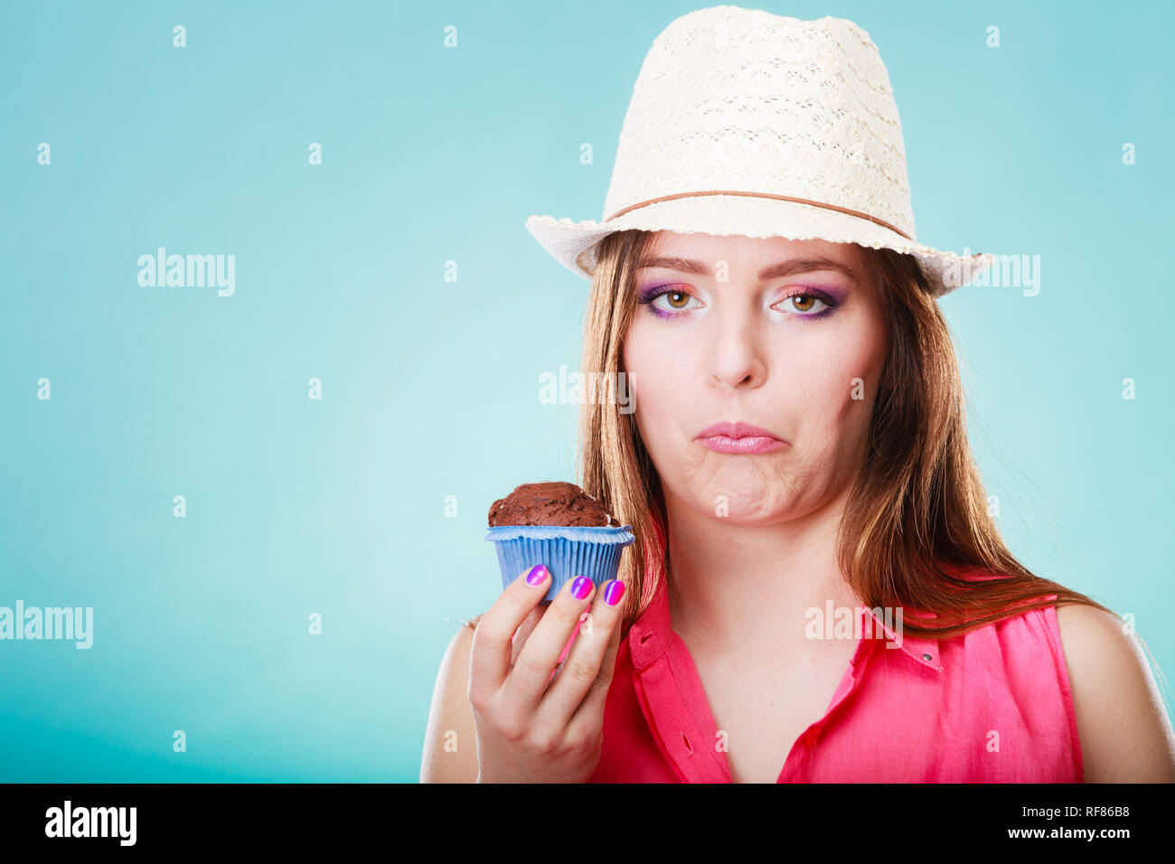 Diet dilemma, grow fat from eating sweets concept. Sad unhappy woman ...