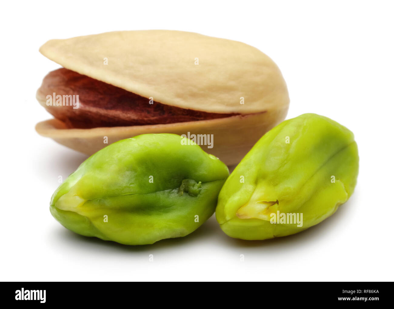 Peeled and whole pistachio nuts isolated on white background Stock ...