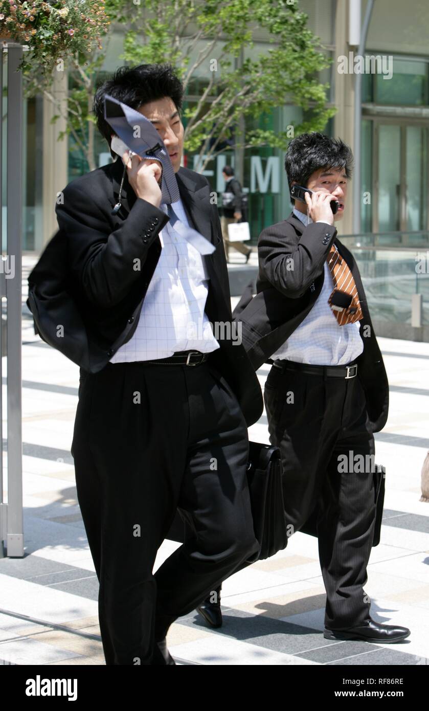 Asian businessmen with mobile phones, Tokyo, Japan Stock Photo - Alamy