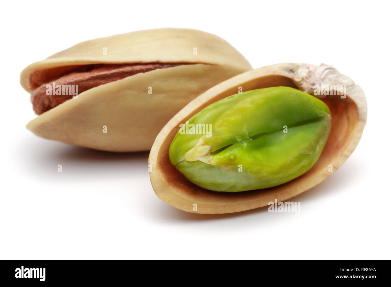 Peeled and whole pistachio nuts isolated on white background Stock ...