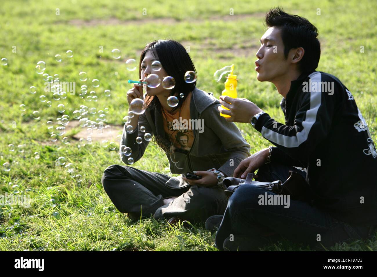 Adolescent make soap bubbles, Yoyogi Park, Harajuku, Tokyo, Japan, Asia ...