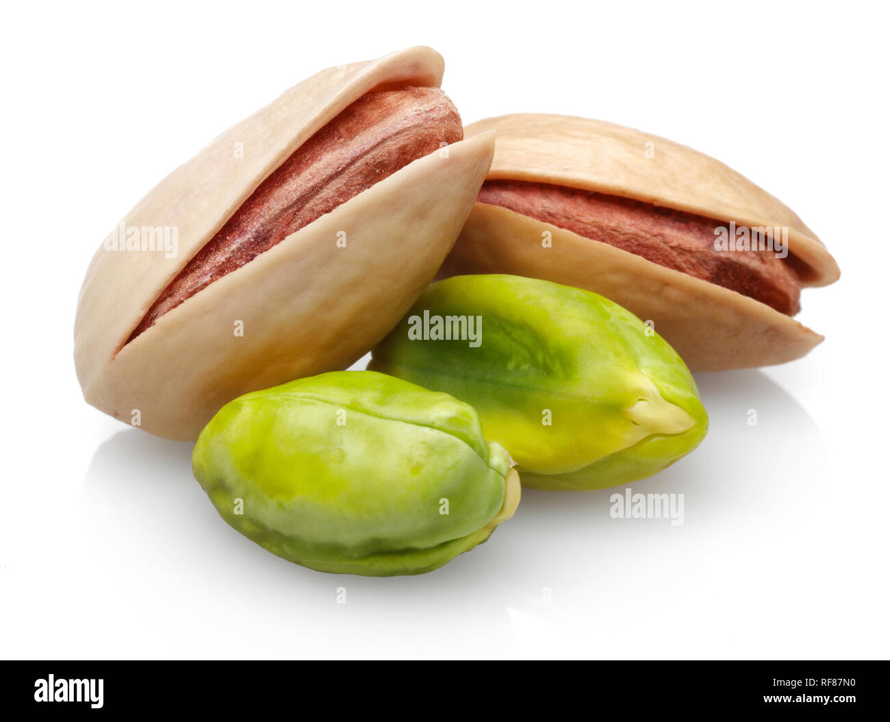 Peeled and whole pistachio nuts isolated on white background Stock ...