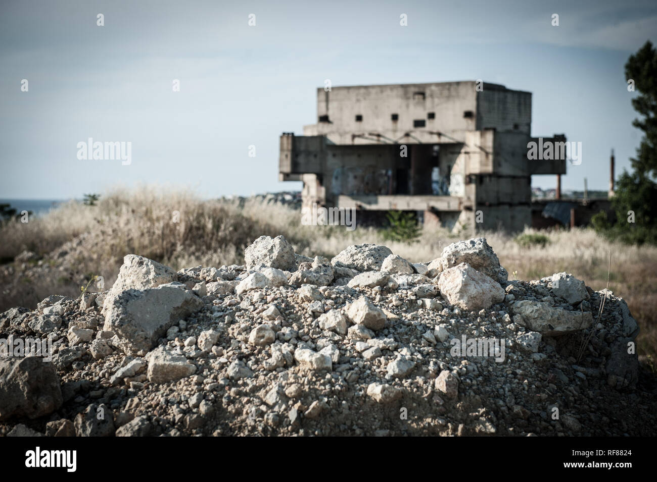 concrete ruins of building construction in war conflict or natural ...
