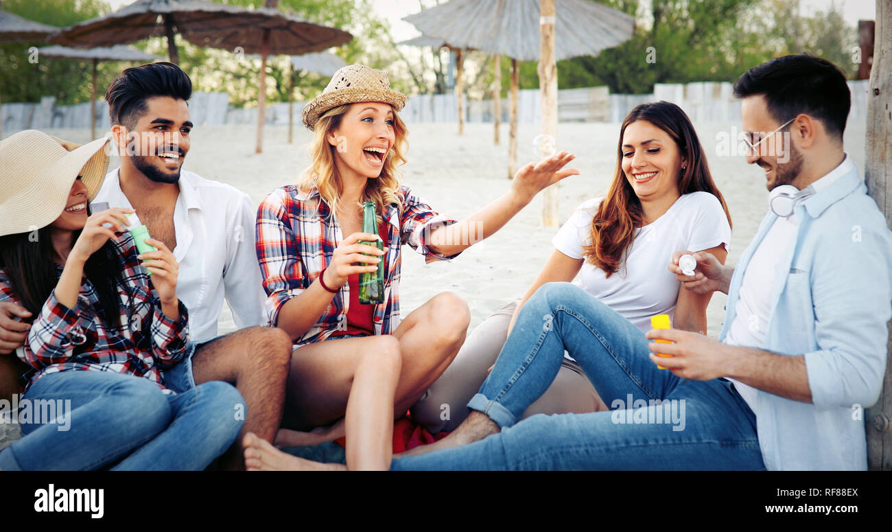 Group people partying tropical beach hi-res stock photography and ...