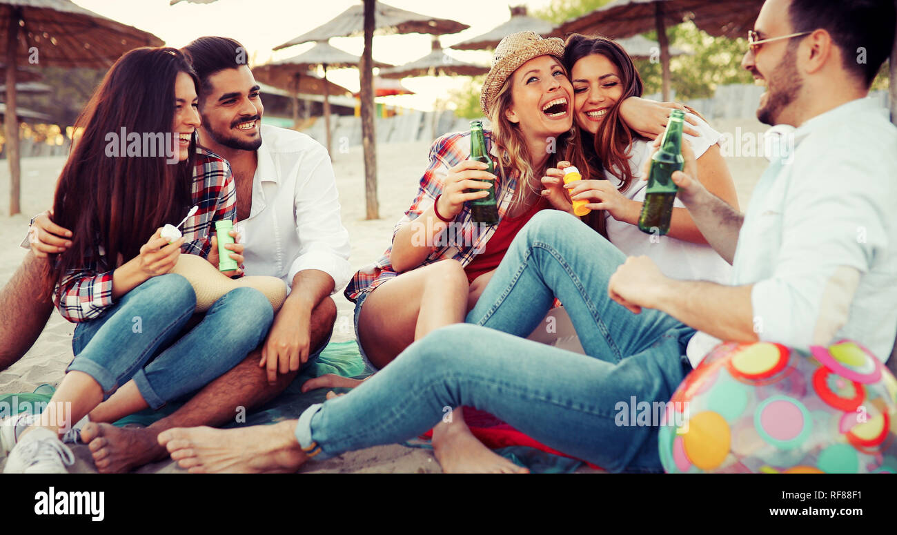 Group people partying tropical beach hi-res stock photography and ...