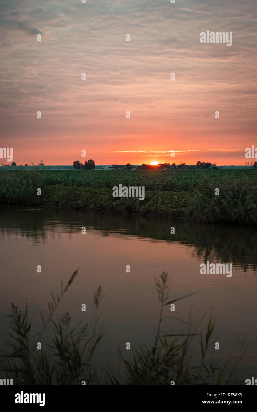 Rustic and colorful sunset over the dutch countryside. Photographed on ...