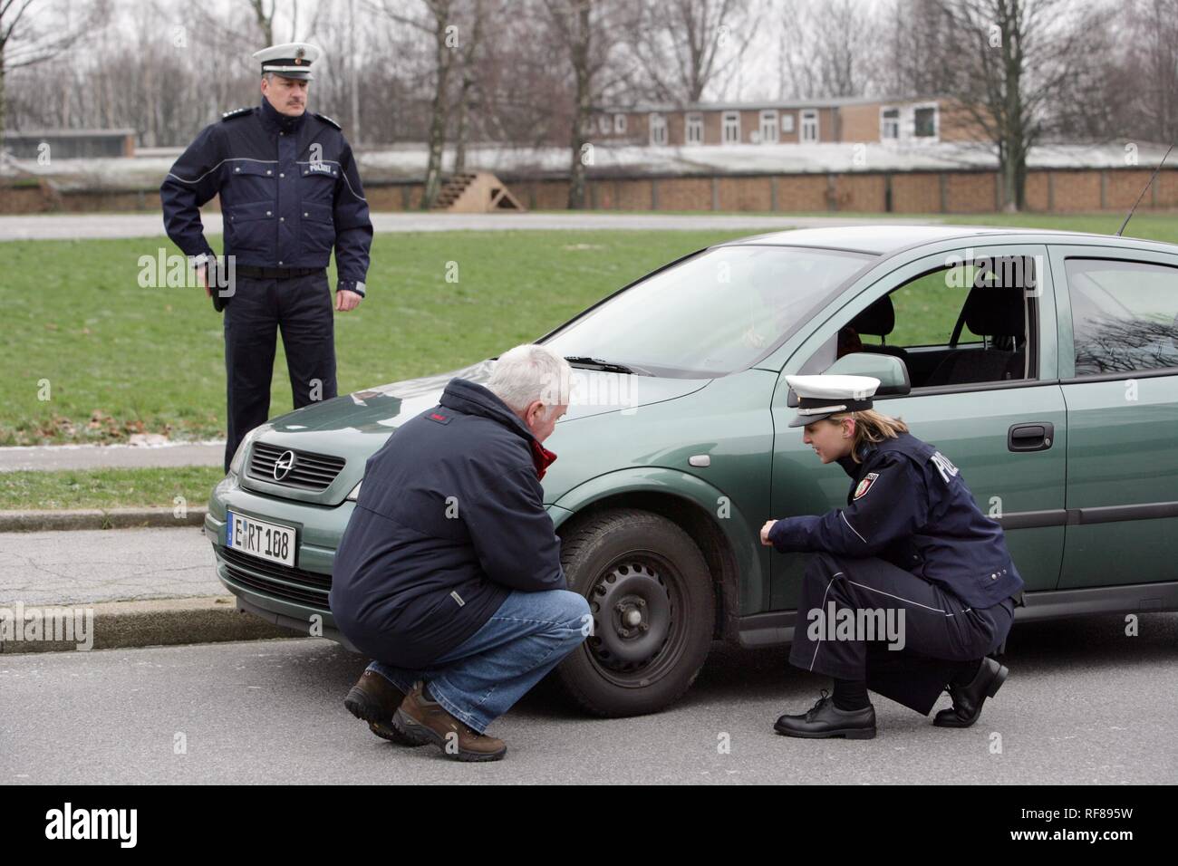 Traffic check, new blue police uniforms worn by 1400 male and female ...