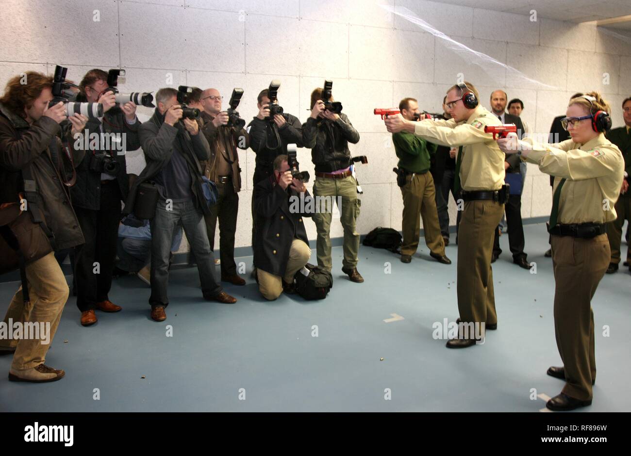 Police officers posing for photographers during a press conference at a ...