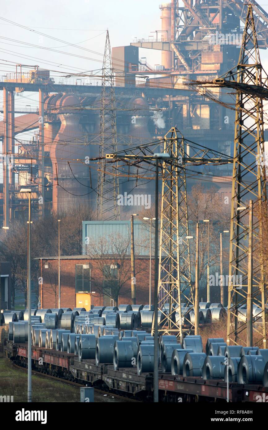 Freight train carrying a load of strip steel rolls, ThyssenKrupp ...