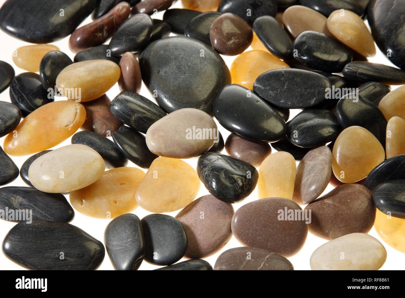 Lots of smooth pebbles, in-studio still-life shot Stock Photo - Alamy