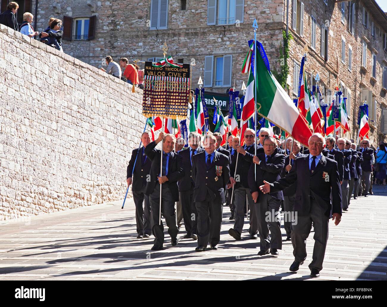 Pilgrimage procession of the fire brigade, Assisi, Umbria, Italy Stock ...