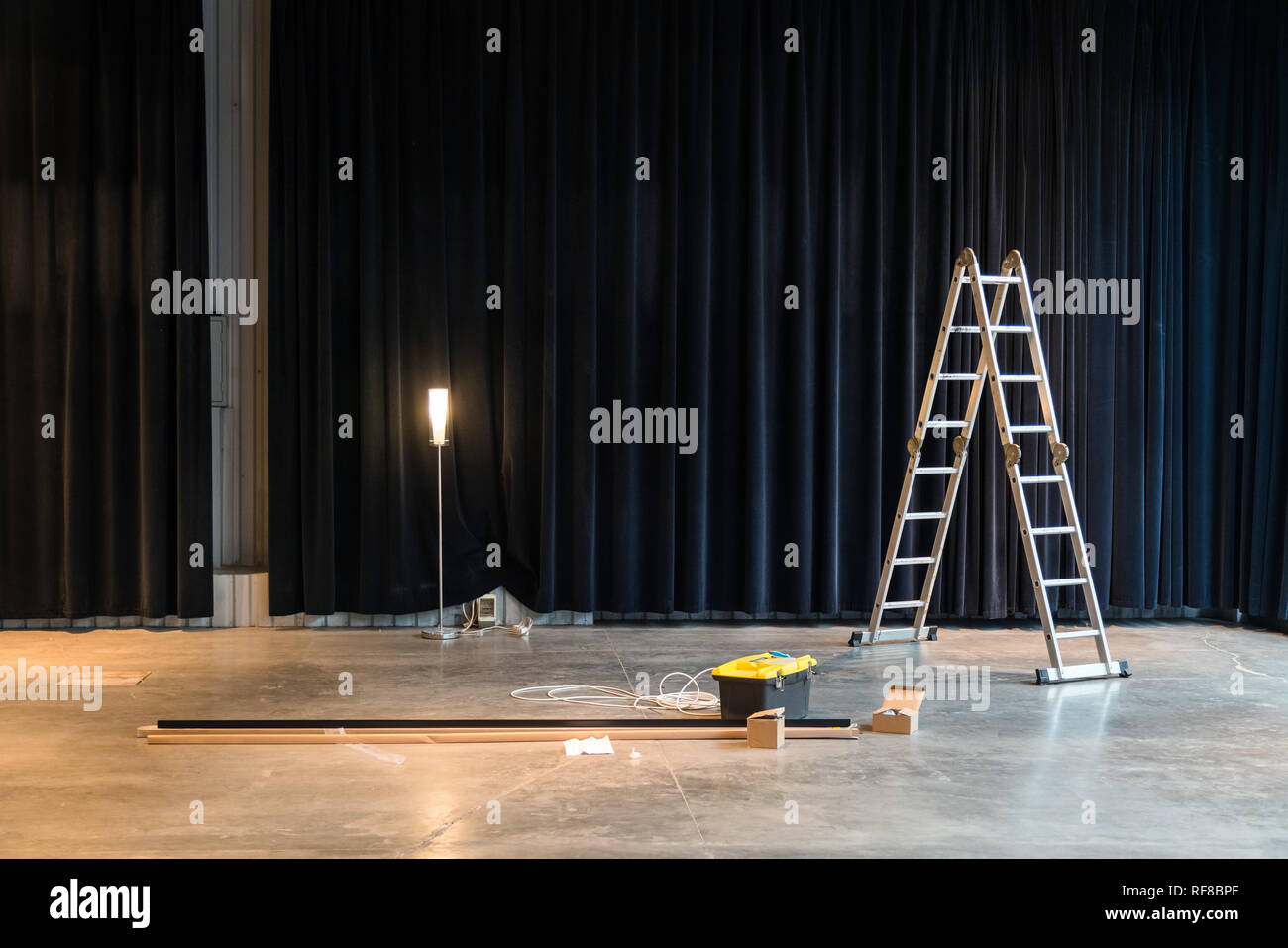 Construction in factory building or warehouse interior. Ladder ...