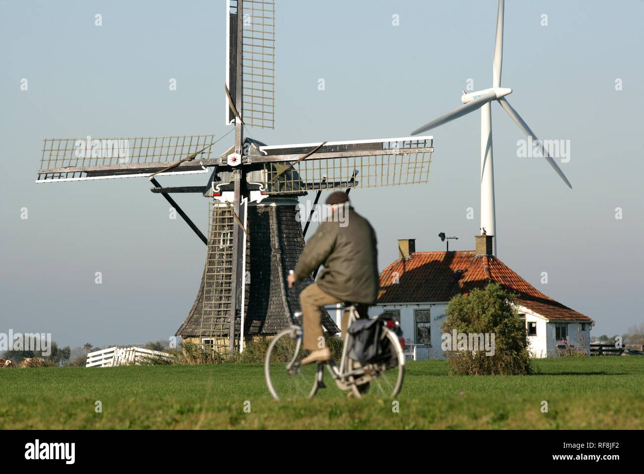 Baburenmolen historic windmill with modern wind turbines in background ...