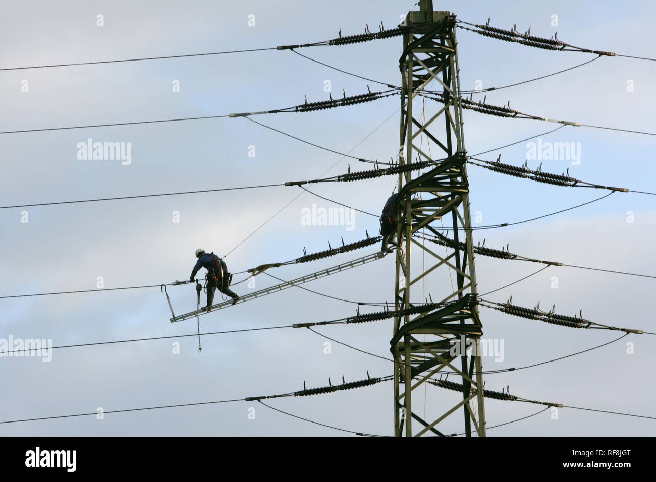 Man working on high voltage power lines hi-res stock photography and ...