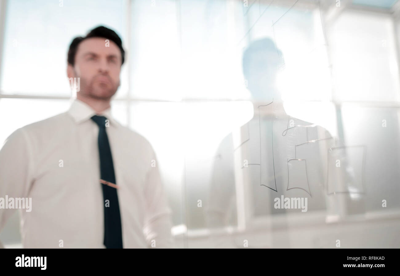 serious businessman looking for a new marketing scheme Stock Photo - Alamy