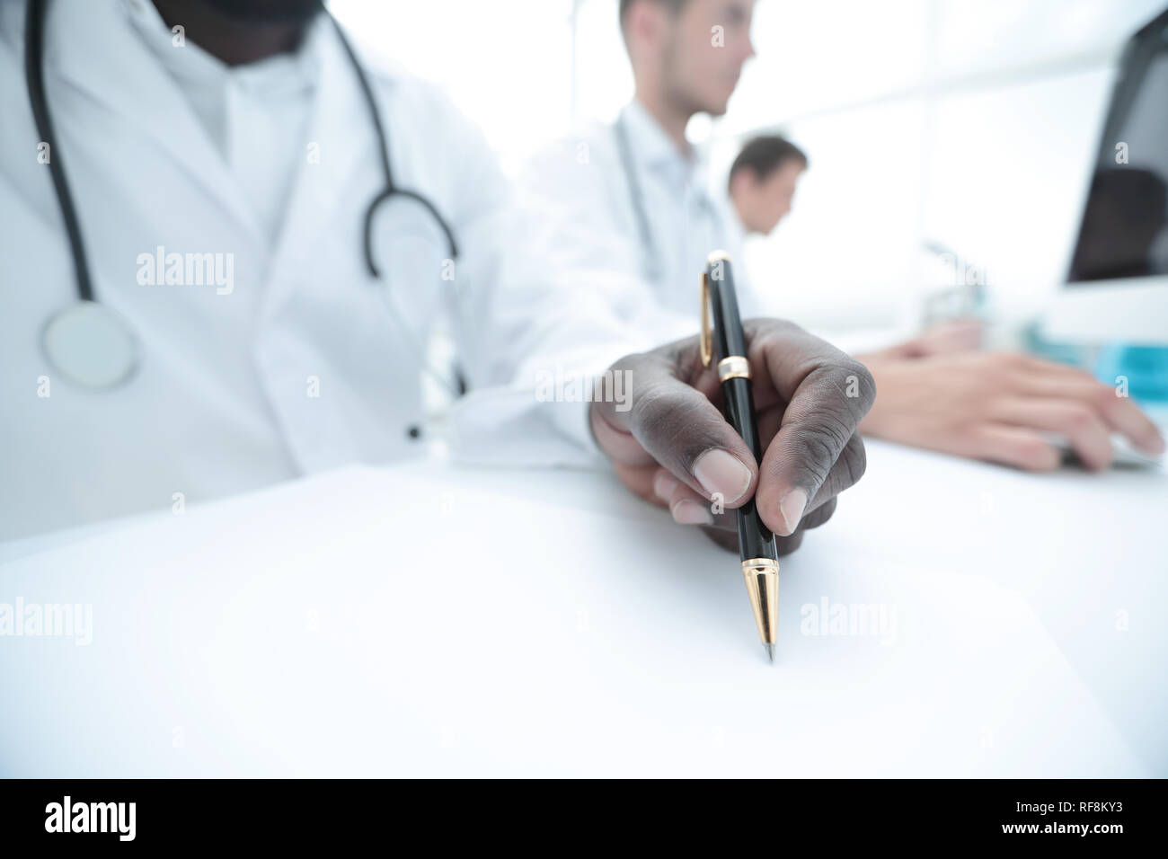 close up.the doctor recording the data in a lab journal Stock Photo - Alamy