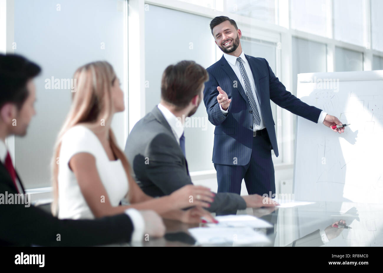 boss, explaining business to the team the company's new strategy Stock ...