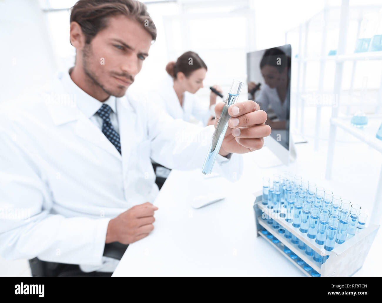 Group of researchers carrying out experiments in the laboratory Stock ...