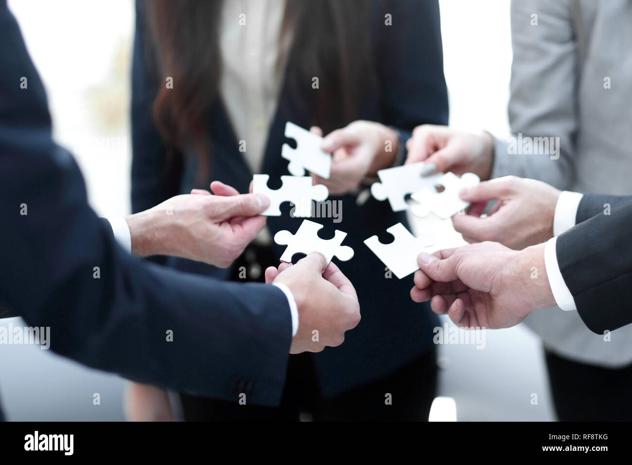 Group of business people assembling jigsaw puzzle, team support Stock ...