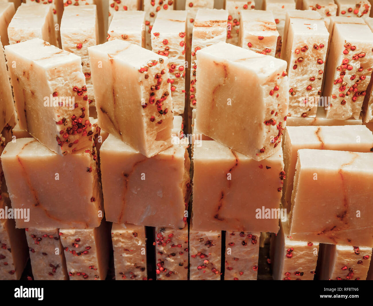 Bars of soap on a shop window. Fruit soap with natural cedar oil and ...