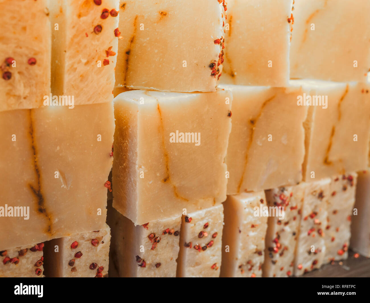 Bars of soap on a shop window. Fruit soap with natural cedar oil and ...
