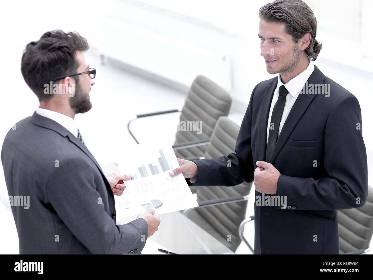 two businessmen talking in the office Stock Photo - Alamy