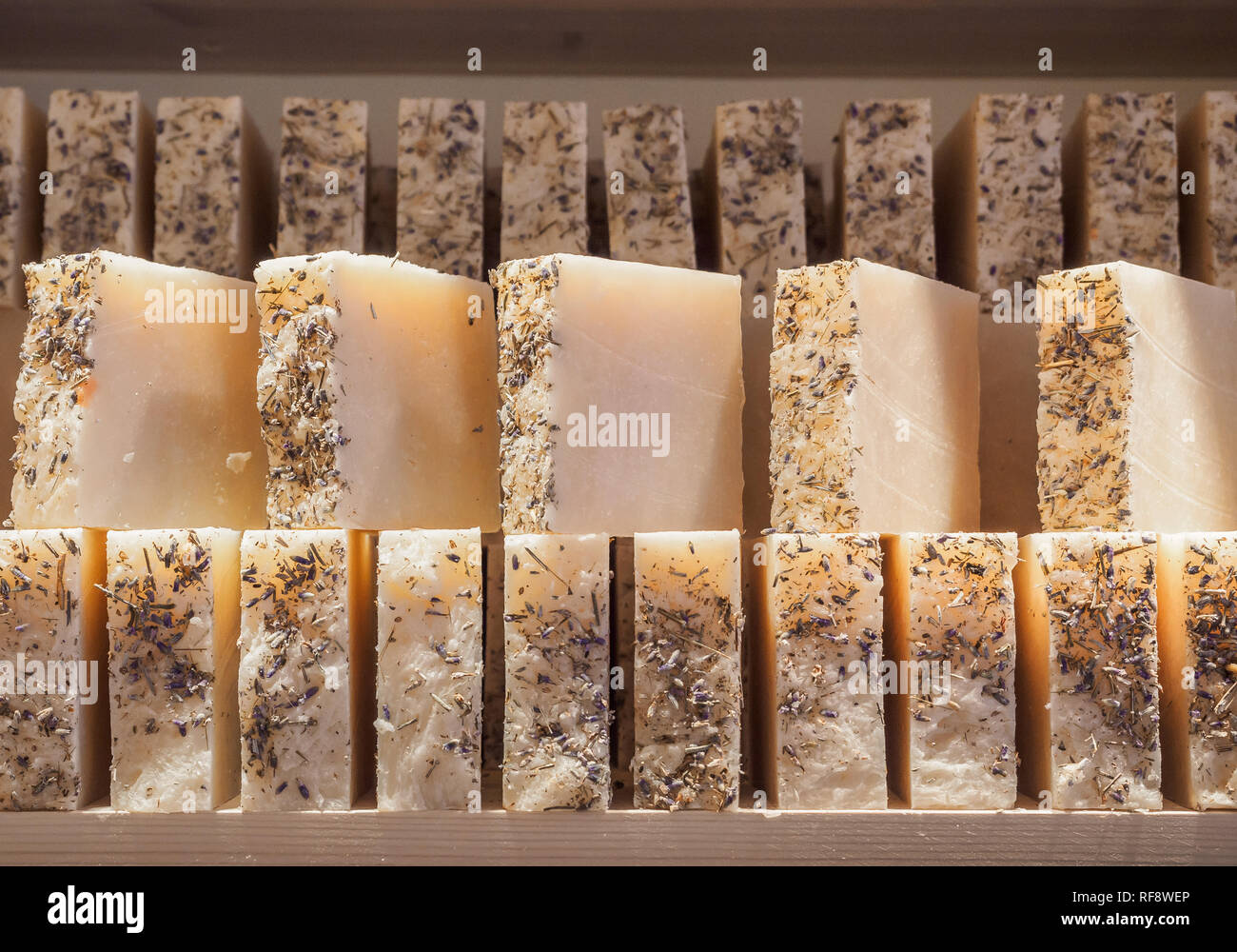 Bars of soap on a shop window. Lavender soap with natural cedar oil ...