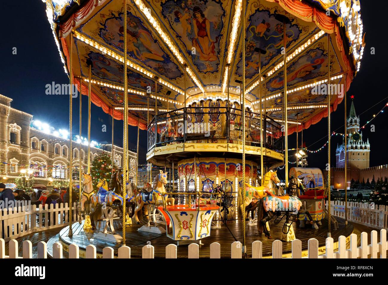 Carousel at the Christmas Market next to the GUM ice rink, GUM-Katok ...