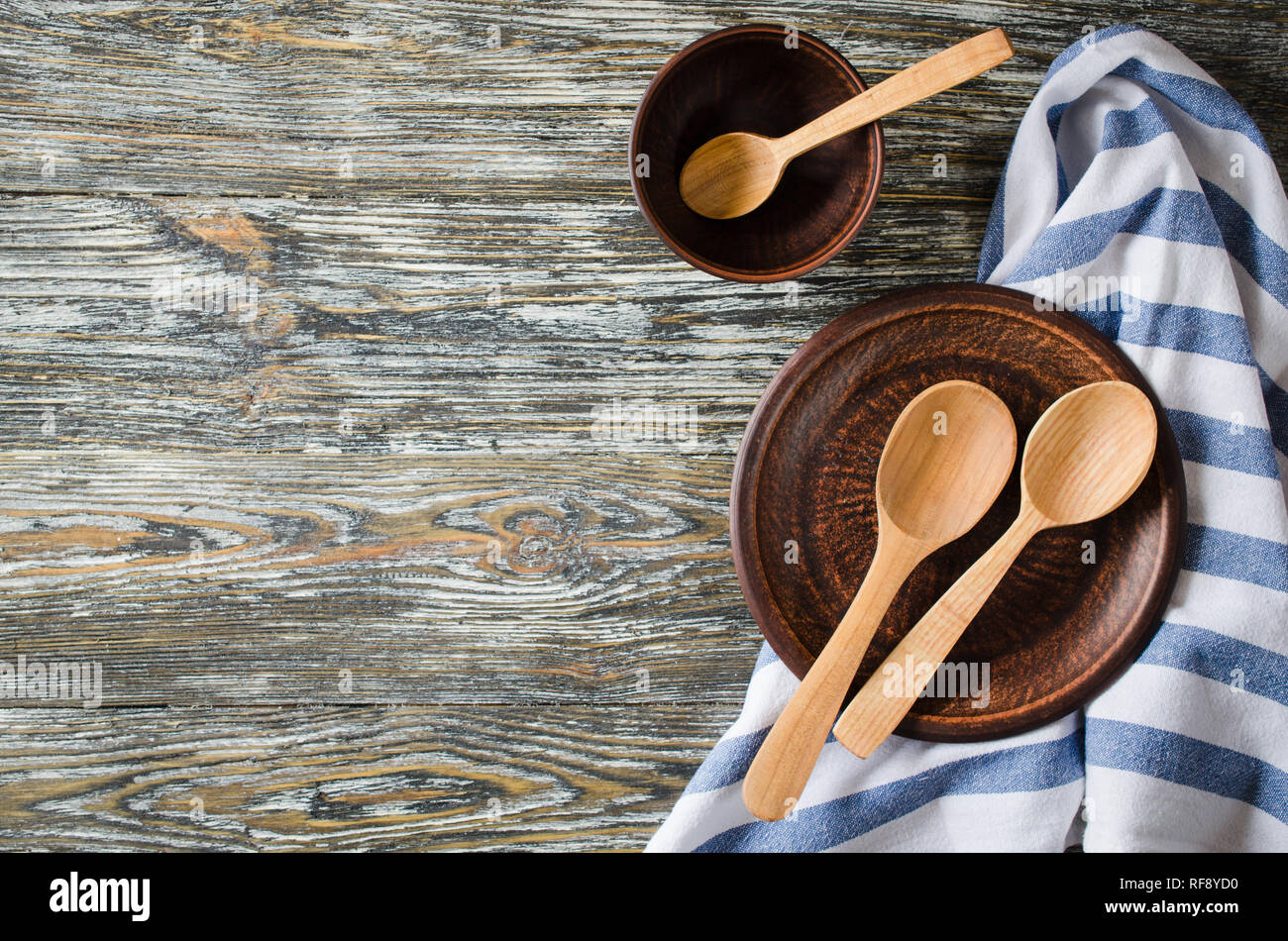 Culinary background with rustic kitchenware: ceramic plates, wooden or ...