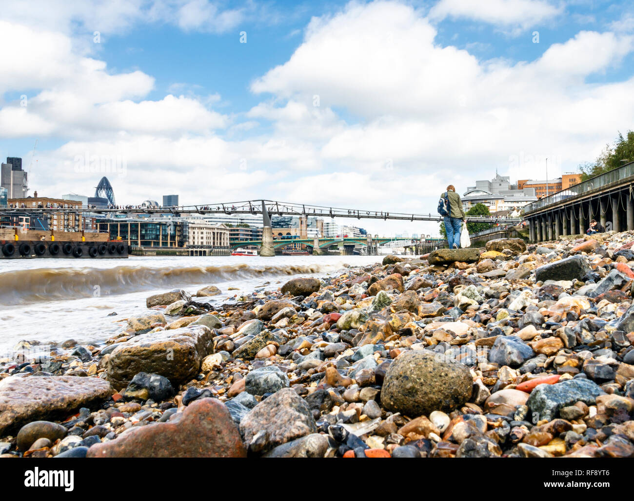 Low angle shot of the River Thames shore at Bankside, London, UK ...