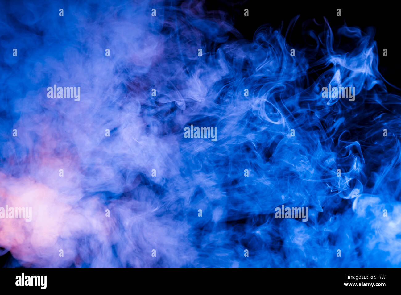 Ice pattern of a rising pair of blue exhaled vape neon blue on a black ...